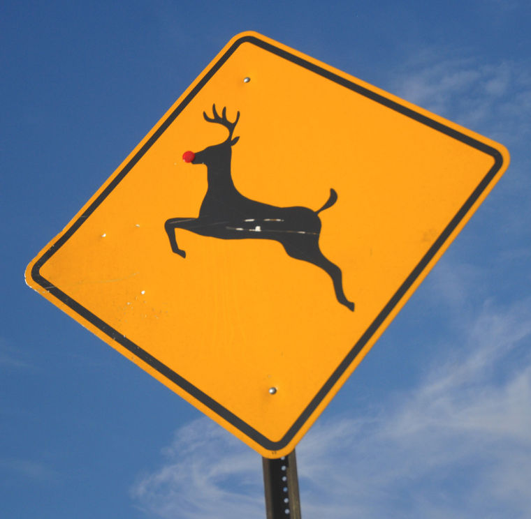 It’s Rudolph by a nose: Mysterious elf alters deer crossing signs ...